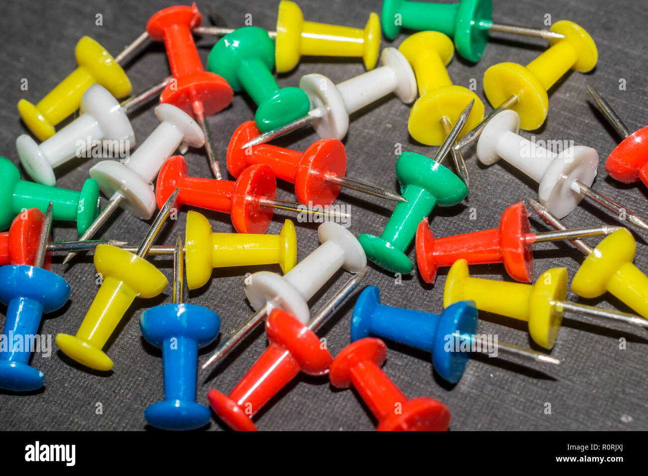 colorful push pins. office and school supply background Stock Photo - Alamy