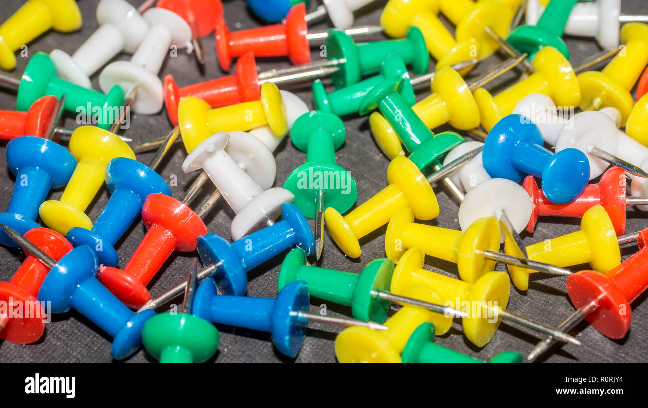 colorful push pins. office and school supply background Stock Photo - Alamy