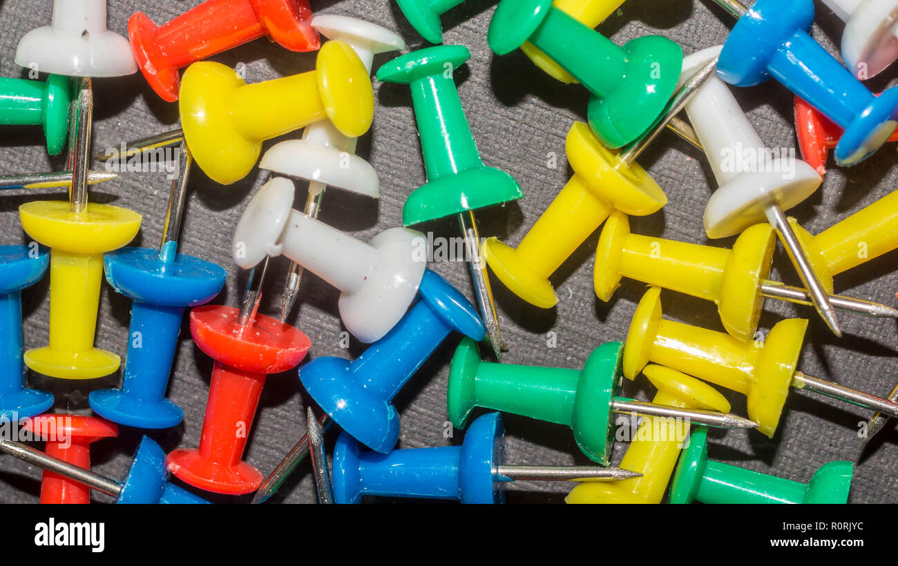 colorful push pins. office and school supply background Stock Photo - Alamy