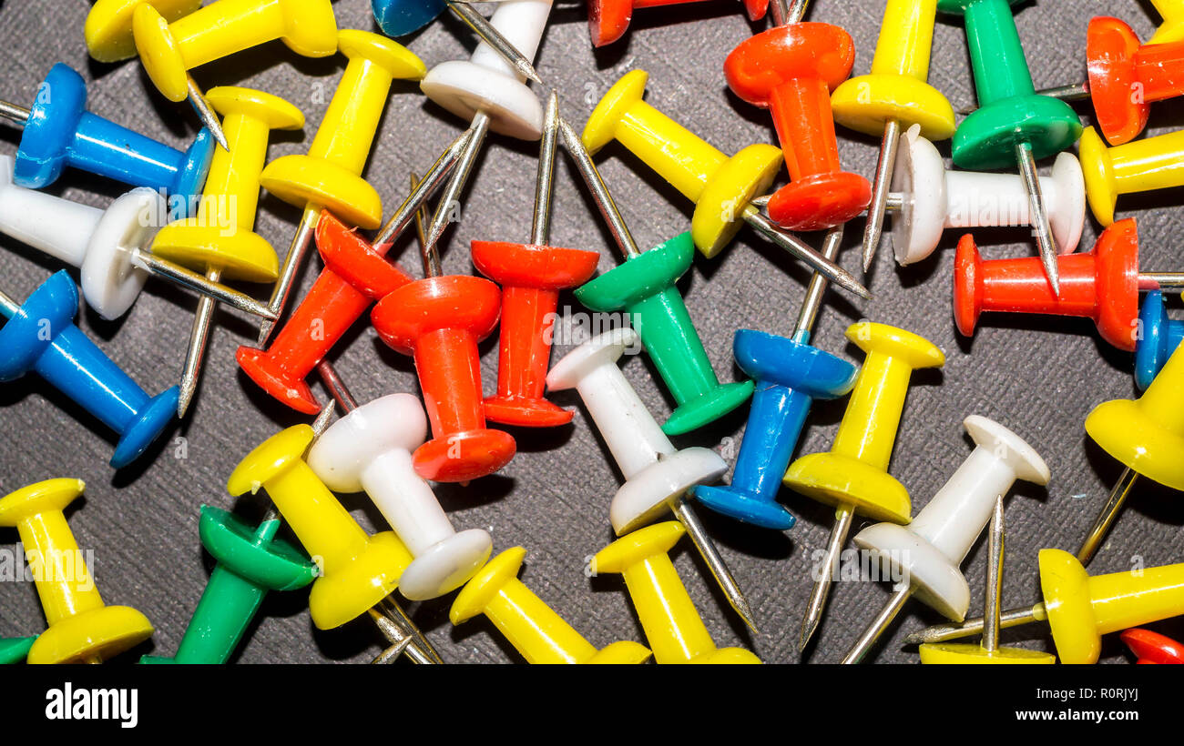 colorful push pins. office and school supply background Stock Photo - Alamy