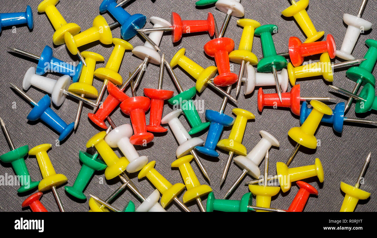colorful push pins. office and school supply background Stock Photo - Alamy