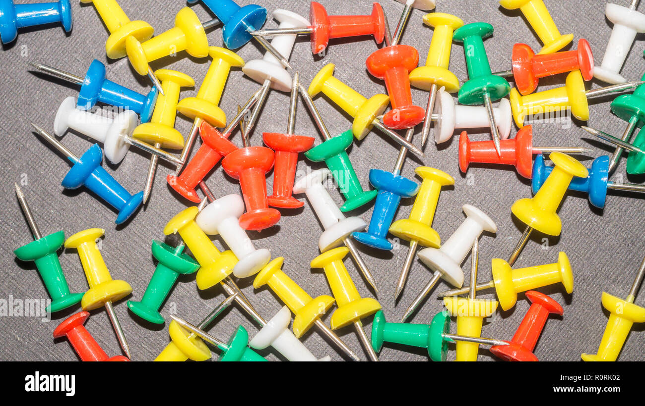colorful push pins. office and school supply background Stock Photo - Alamy