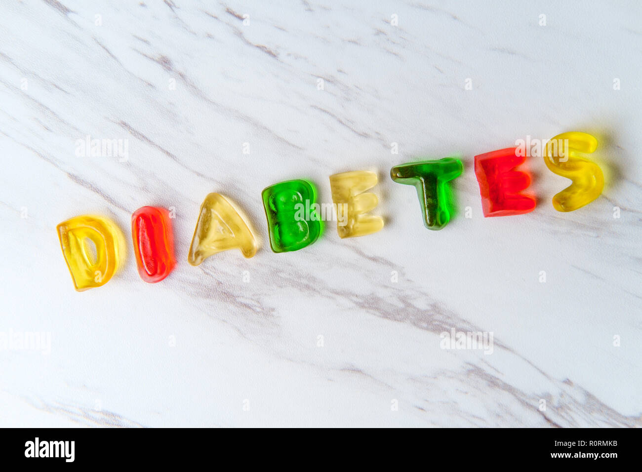 Assorted colorful gummy candy letters spell the word Diabetes Stock ...