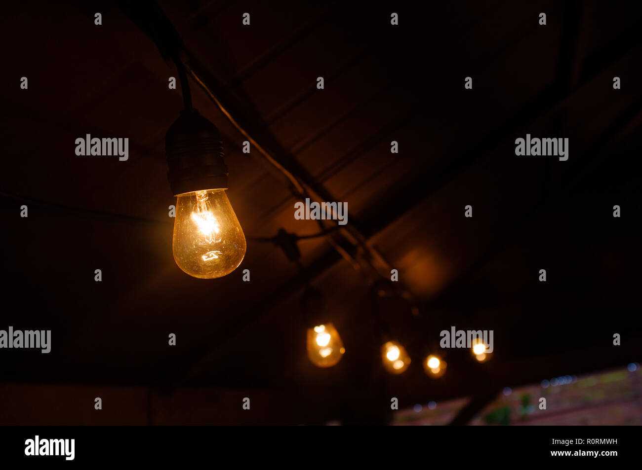 String of decorative antique edison style light bulbs Stock Photo - Alamy