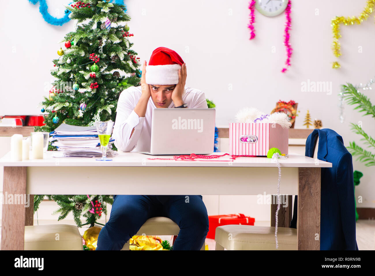Employee businessman celebrating christmas in office Stock Photo - Alamy