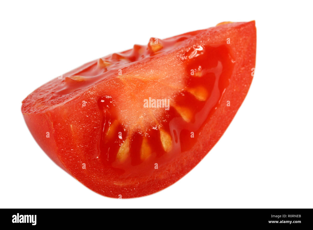 Tomato. Piece isolated on white Stock Photo - Alamy