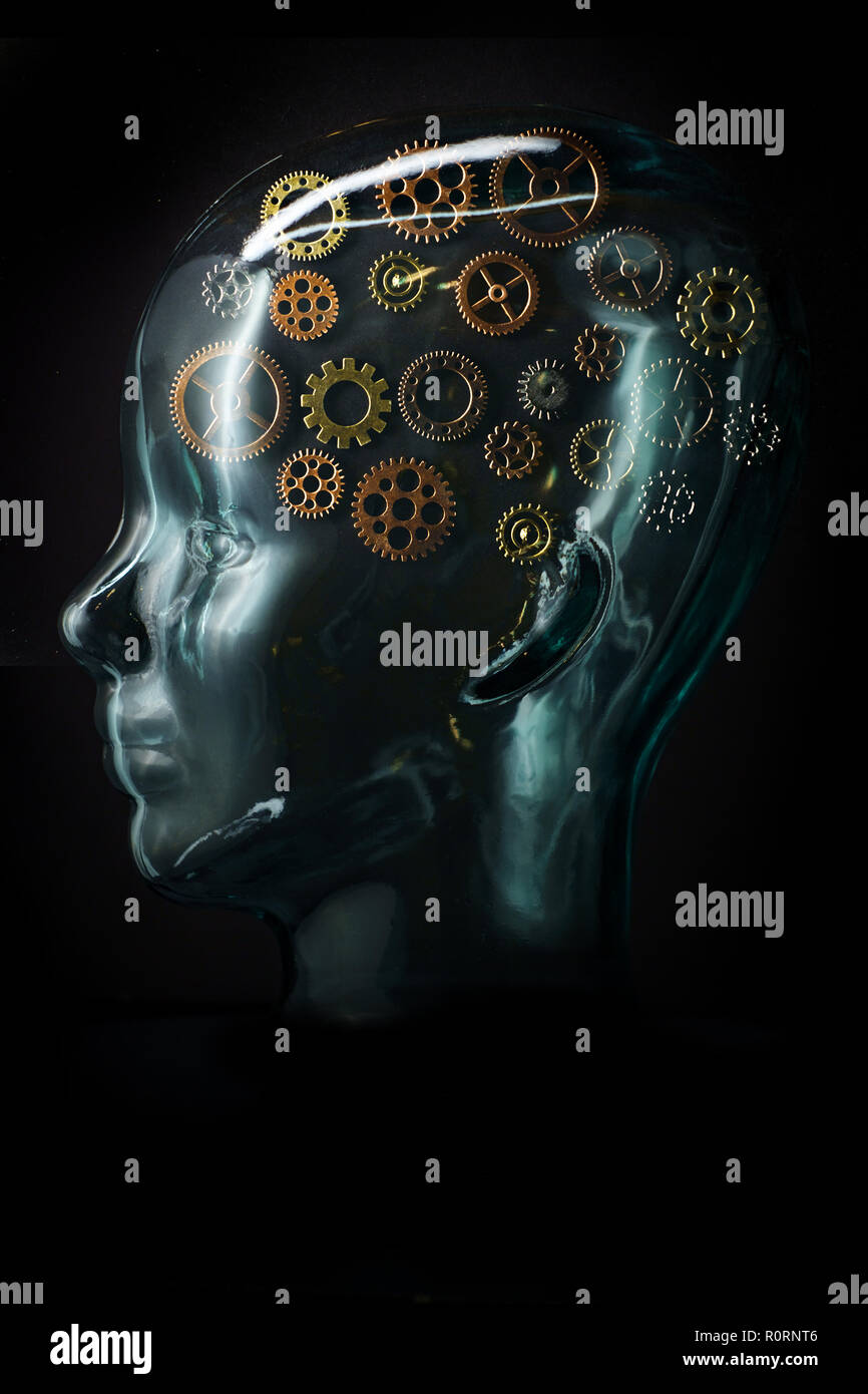 Gears inside glass head to symbolize brain activity for creativity and ...