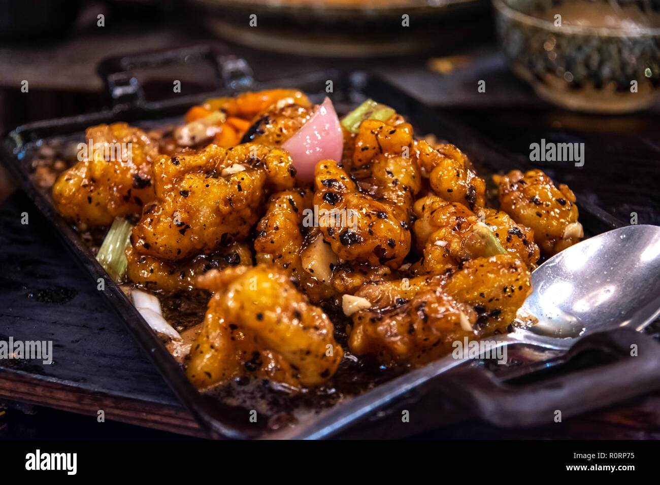 Asian Food fried squid with spoon, Philippines Stock Photo - Alamy