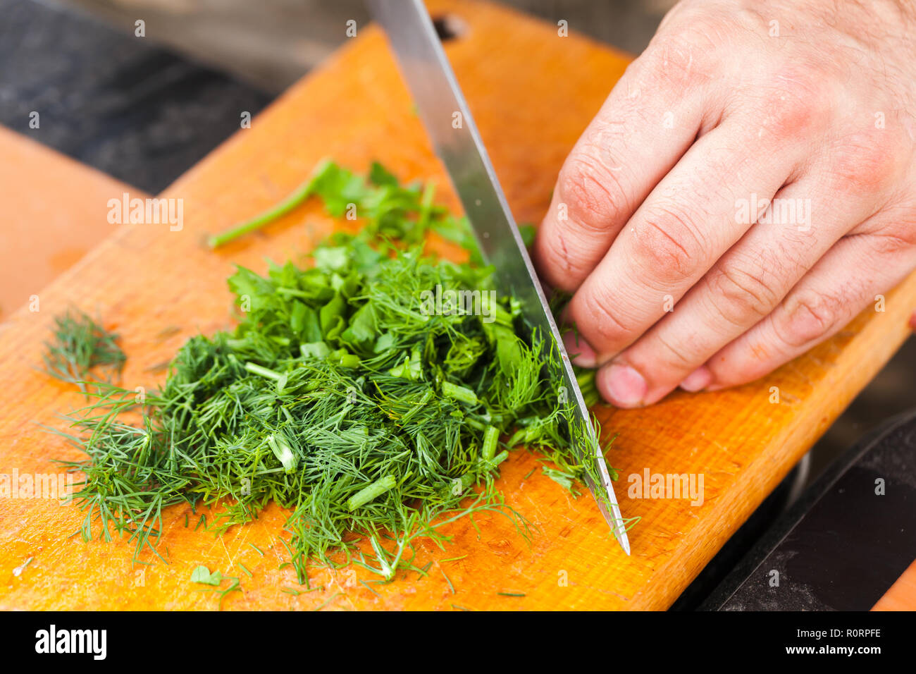 Hand with knife hi-res stock photography and images - Alamy