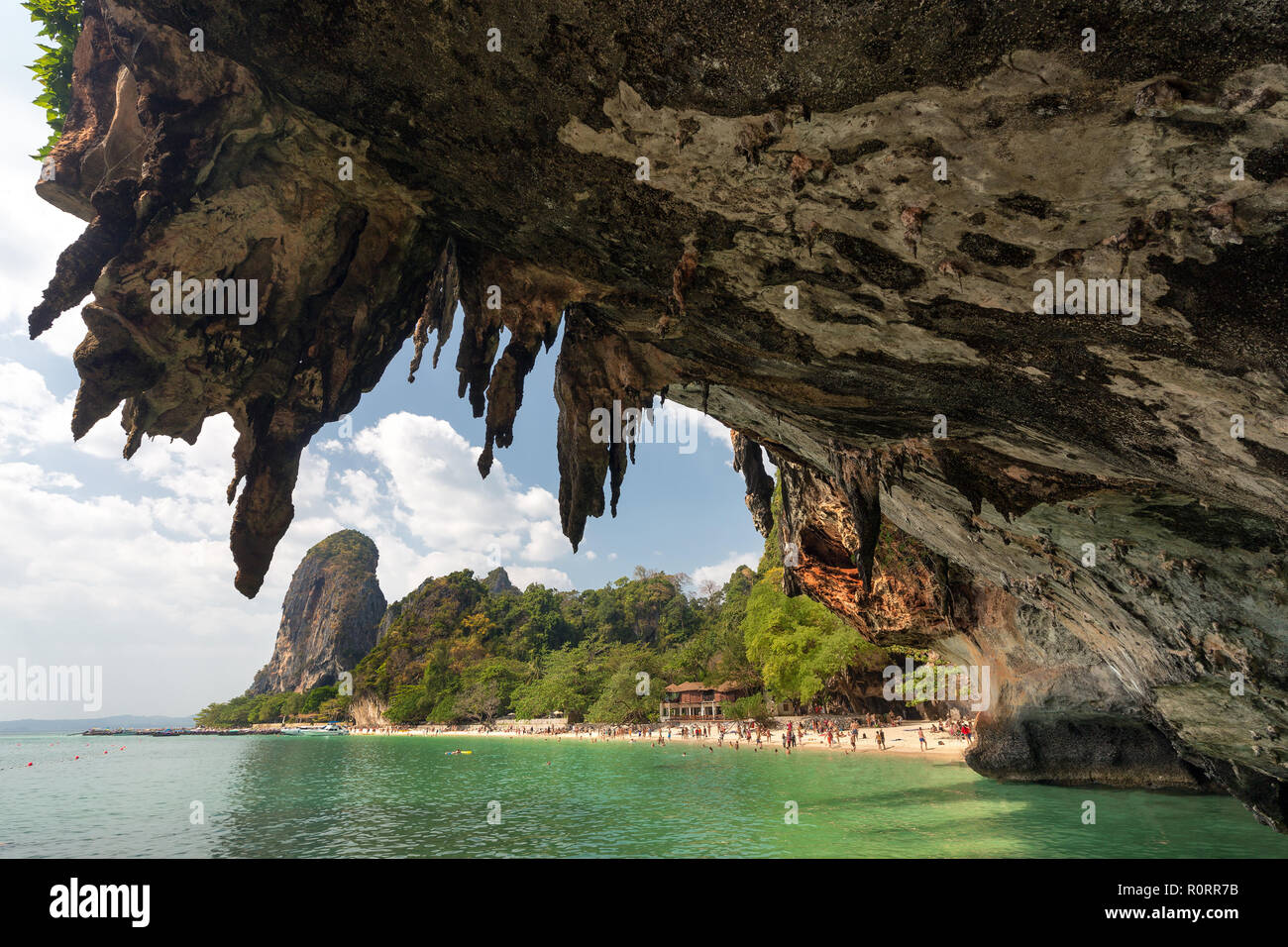 Tropical Phra Nang beach landscape under a huge cave in the Krabi ...