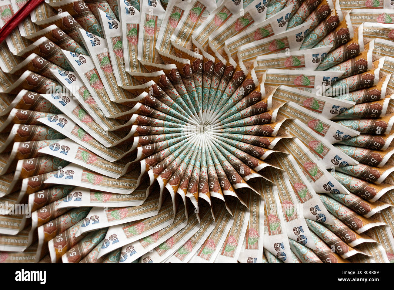 Banknote folded in flower, offering for buddhist temple in Myanmar ...