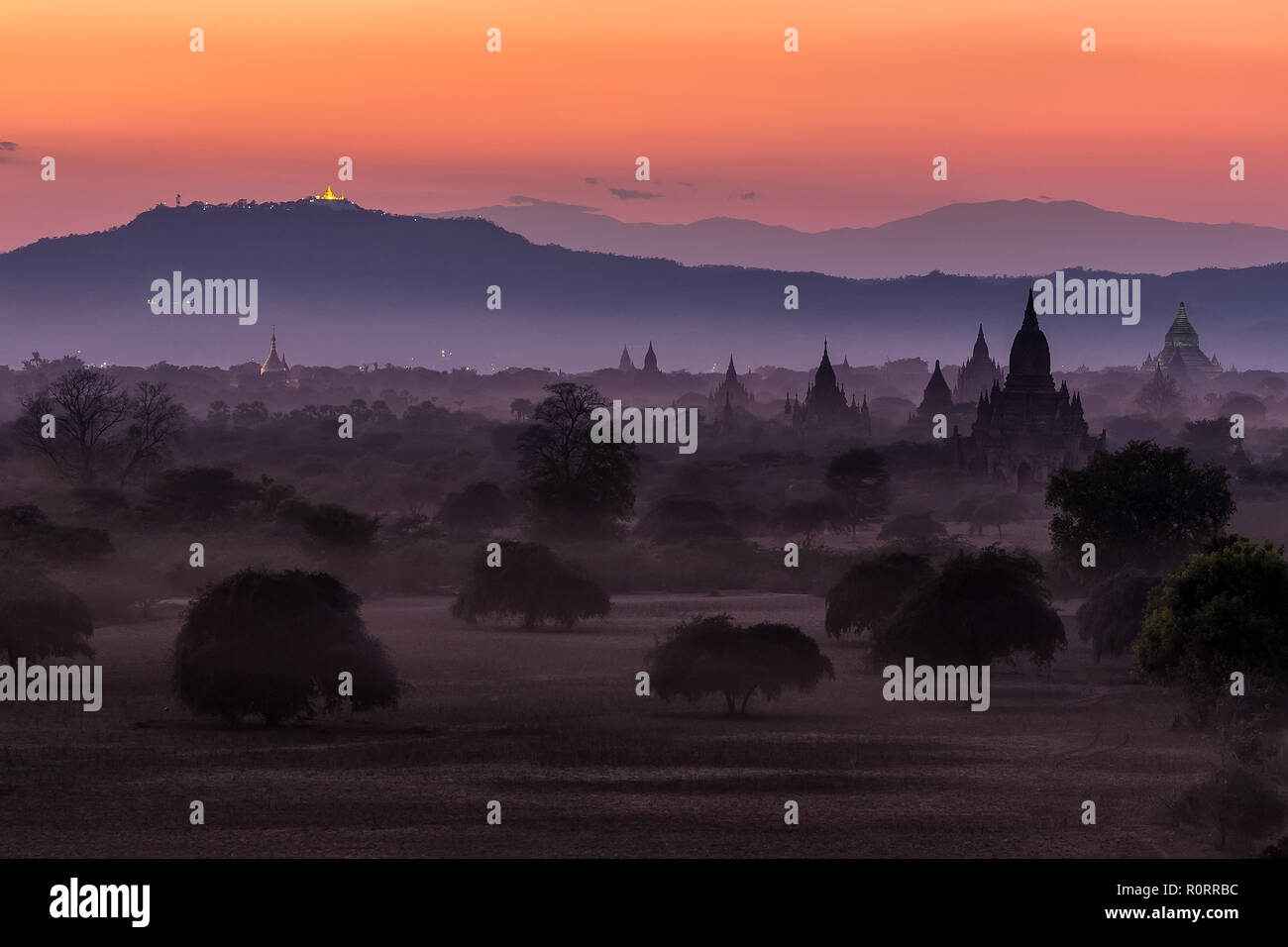 Pagoda landscape under a warm sunset in the plain of Bagan, Myanmar ...