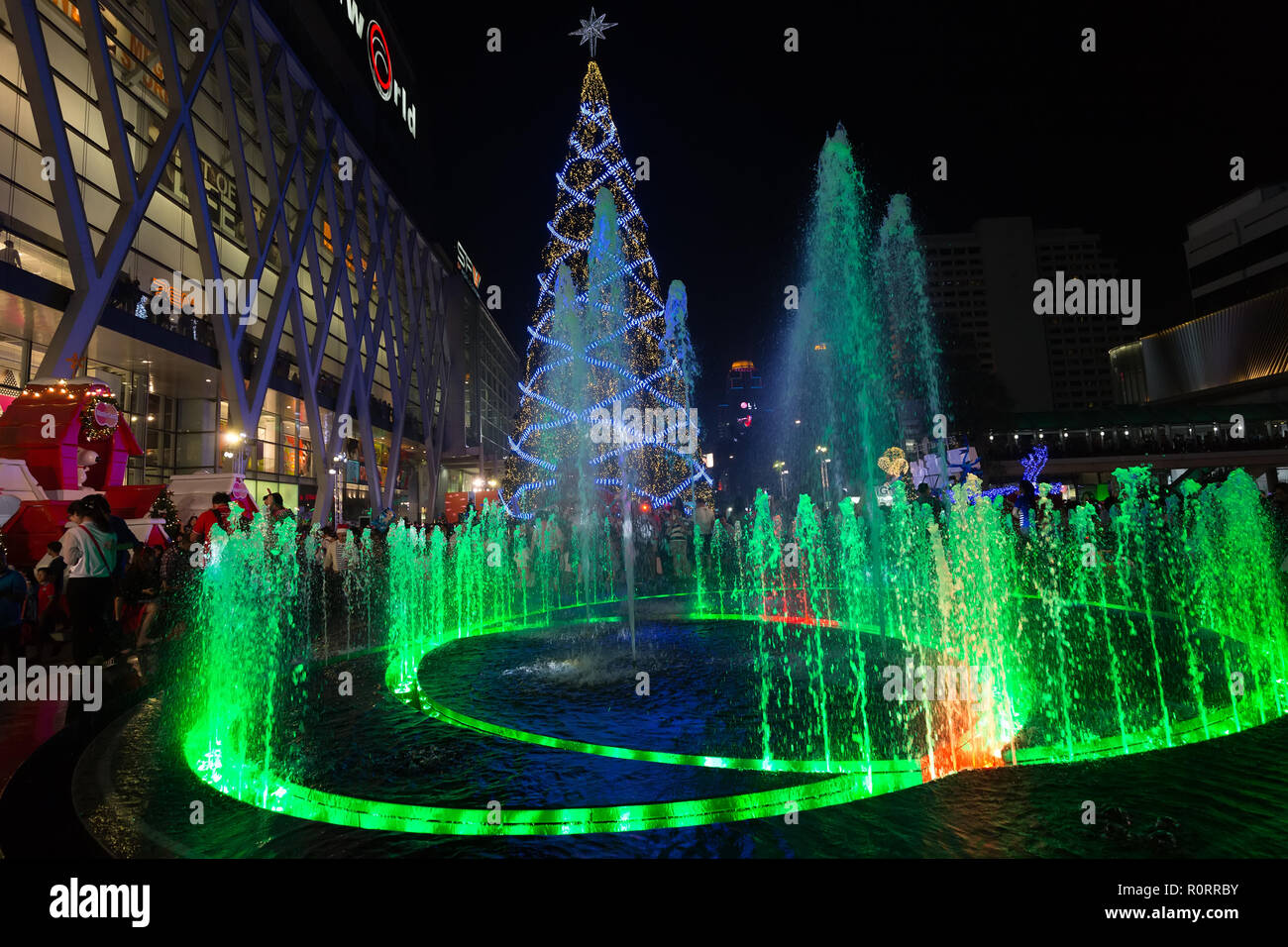 BANGKOK, THAILAND, DECEMBER 25, 2014: Colorful fountain and huge ...