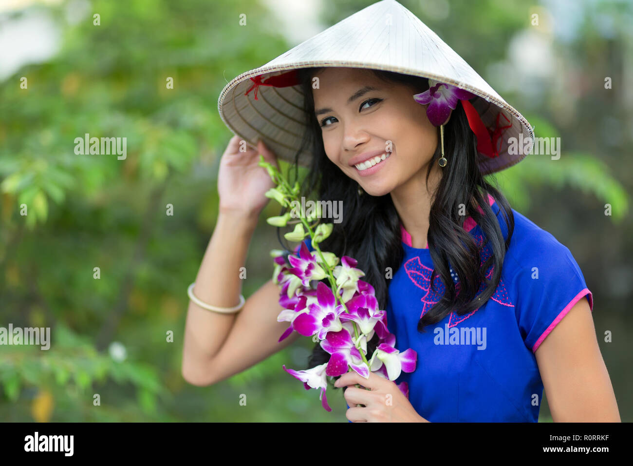 Wearing a traditional vietnamese conical hat hi-res stock photography and images - Alamy