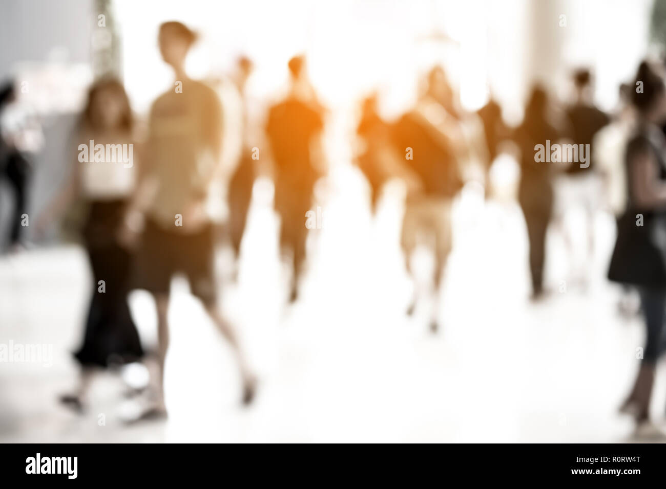 Abstract blur people walking and sunlight shining from behind Stock ...