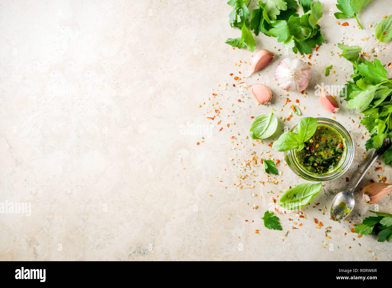 Argentinian traditional food, raw homemade green Chimichurri salsa or ...