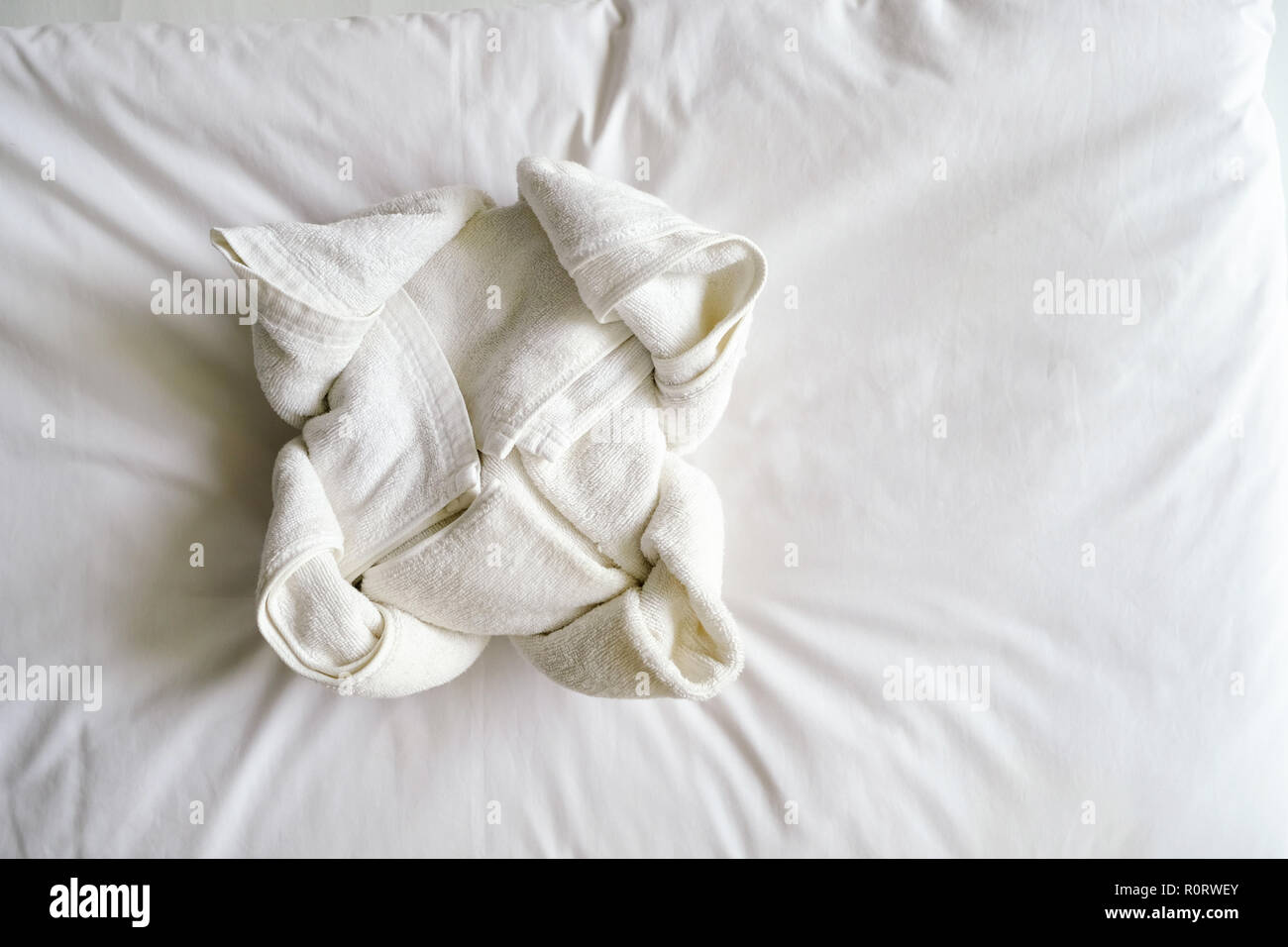 White towel folded in lotus flower shape on the bed in hotel Stock ...