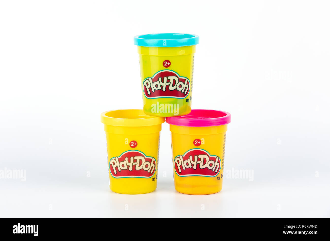 Play-Doh clay in a yellow small container with Red, Yellow and Blue ...