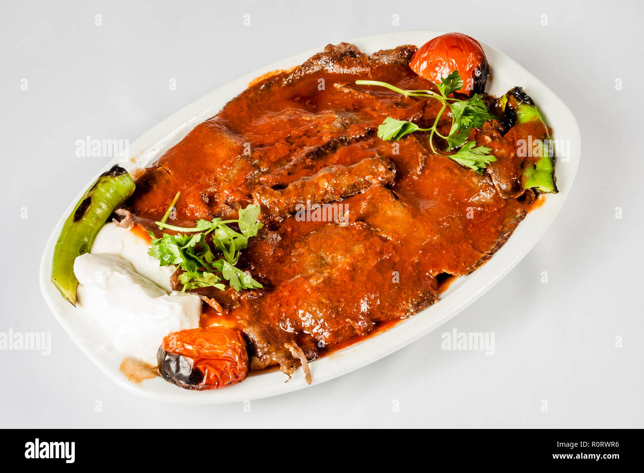 Turkish meat kebab with tomato sauce, green pepper and yoghurt Stock ...