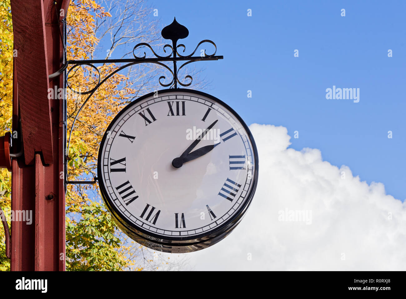 Vintage station clock on natural blue sky background with copy space ...