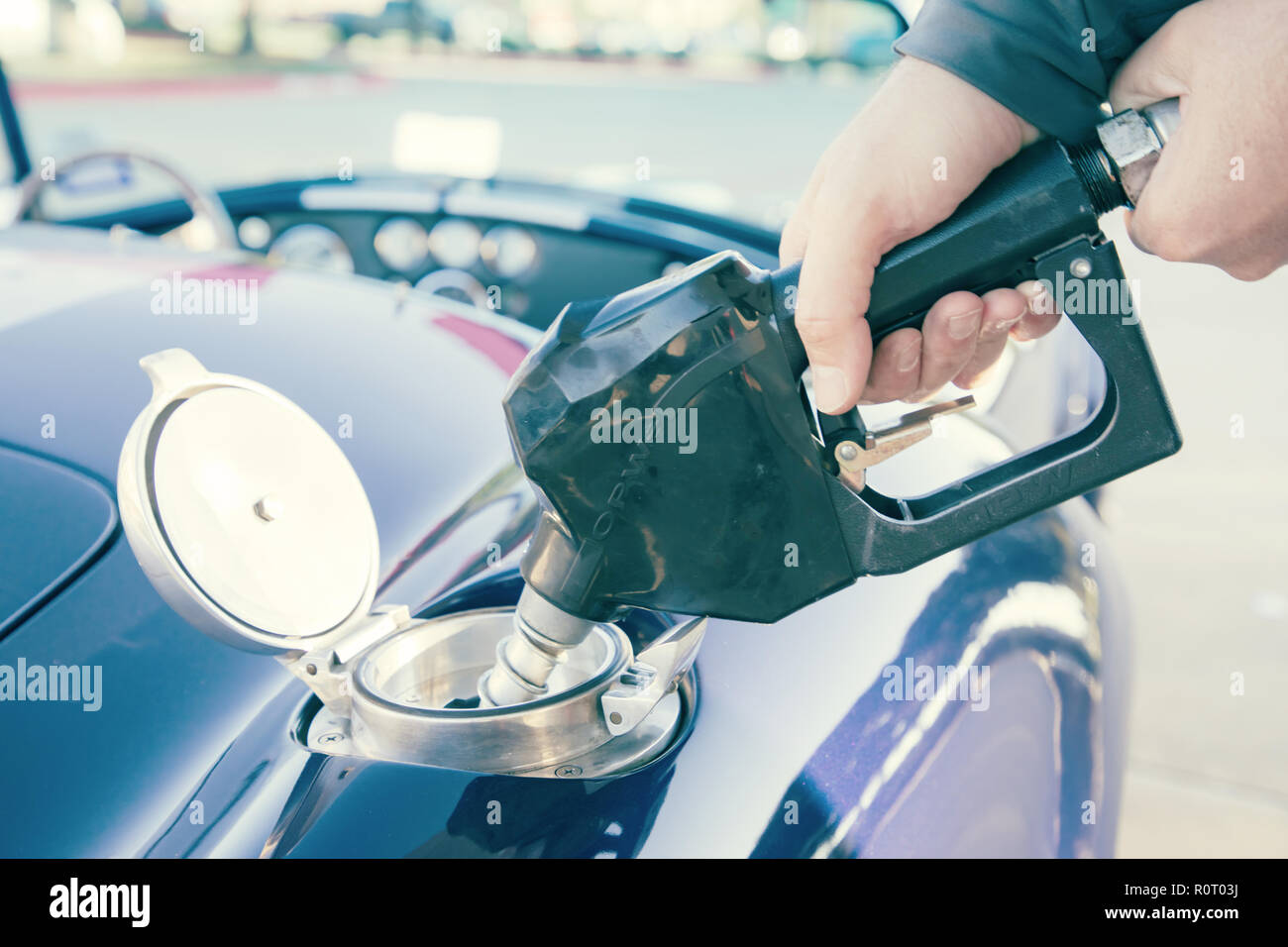 Hand fueling a car Stock Photo - Alamy