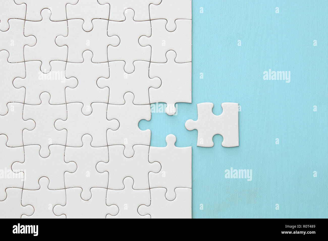 background of white puzzle with missing piece Stock Photo - Alamy