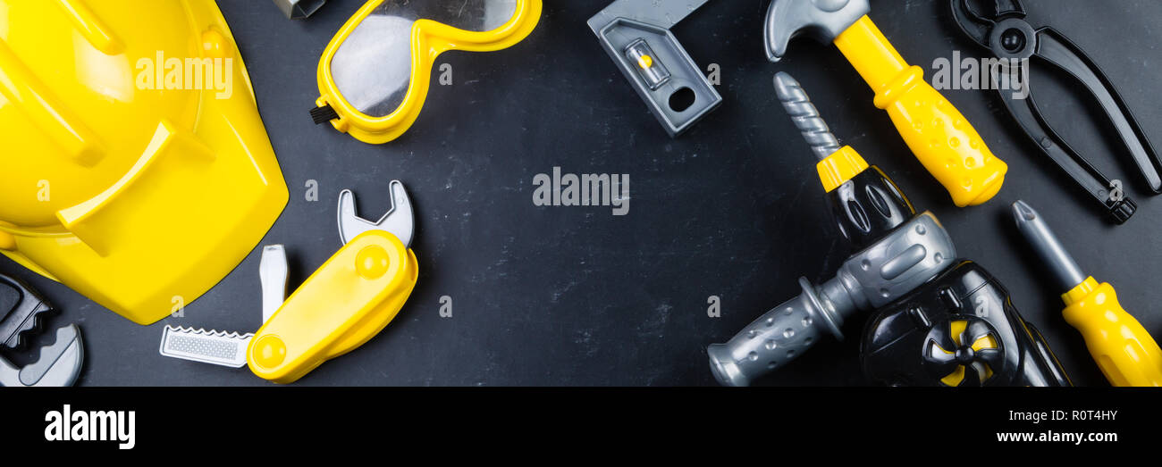 Father's day concept - child tools on black background Stock Photo - Alamy