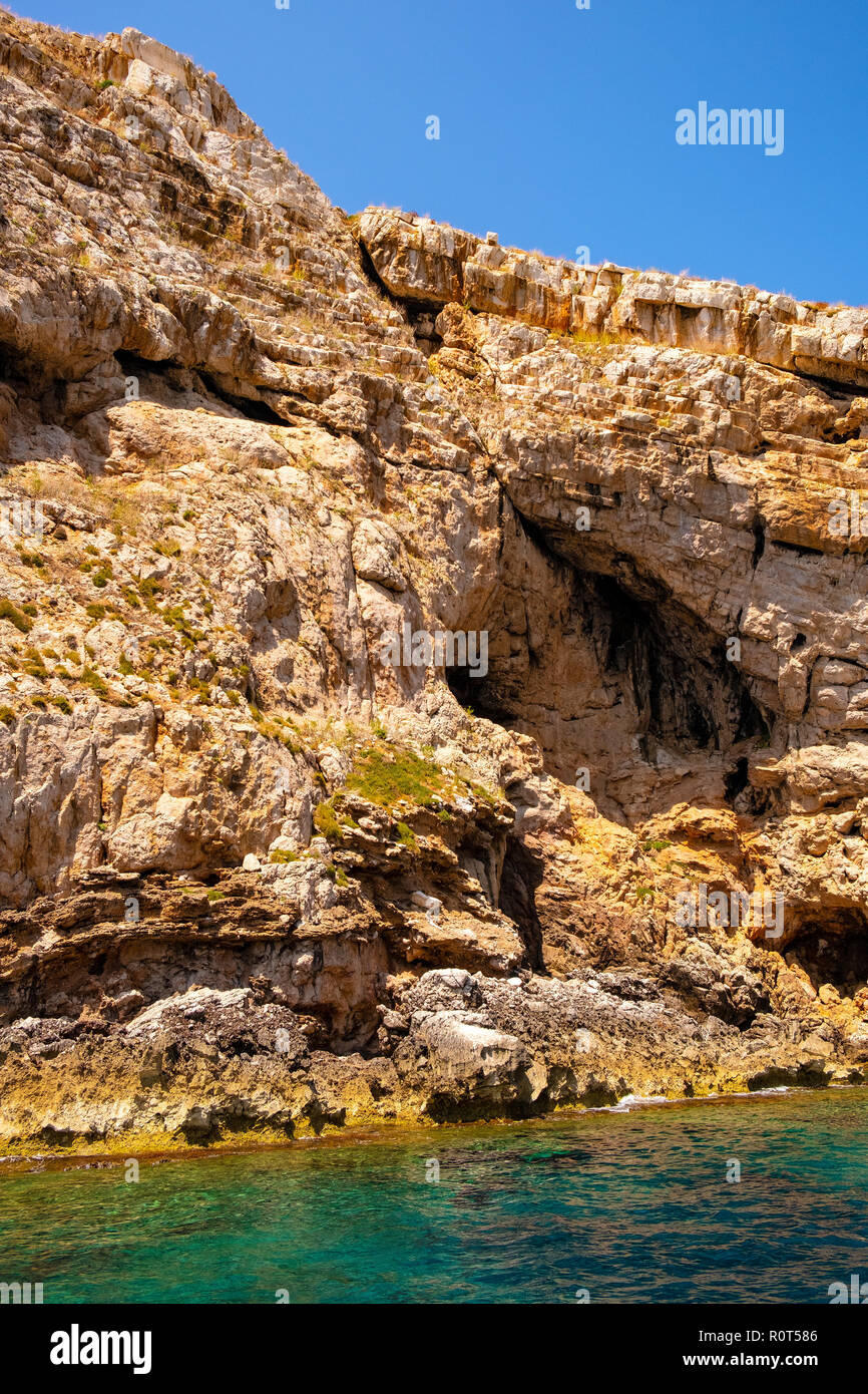 Alghero, Sardinia / Italy - 2018/08/09: Limestone cliffs of the Capo ...