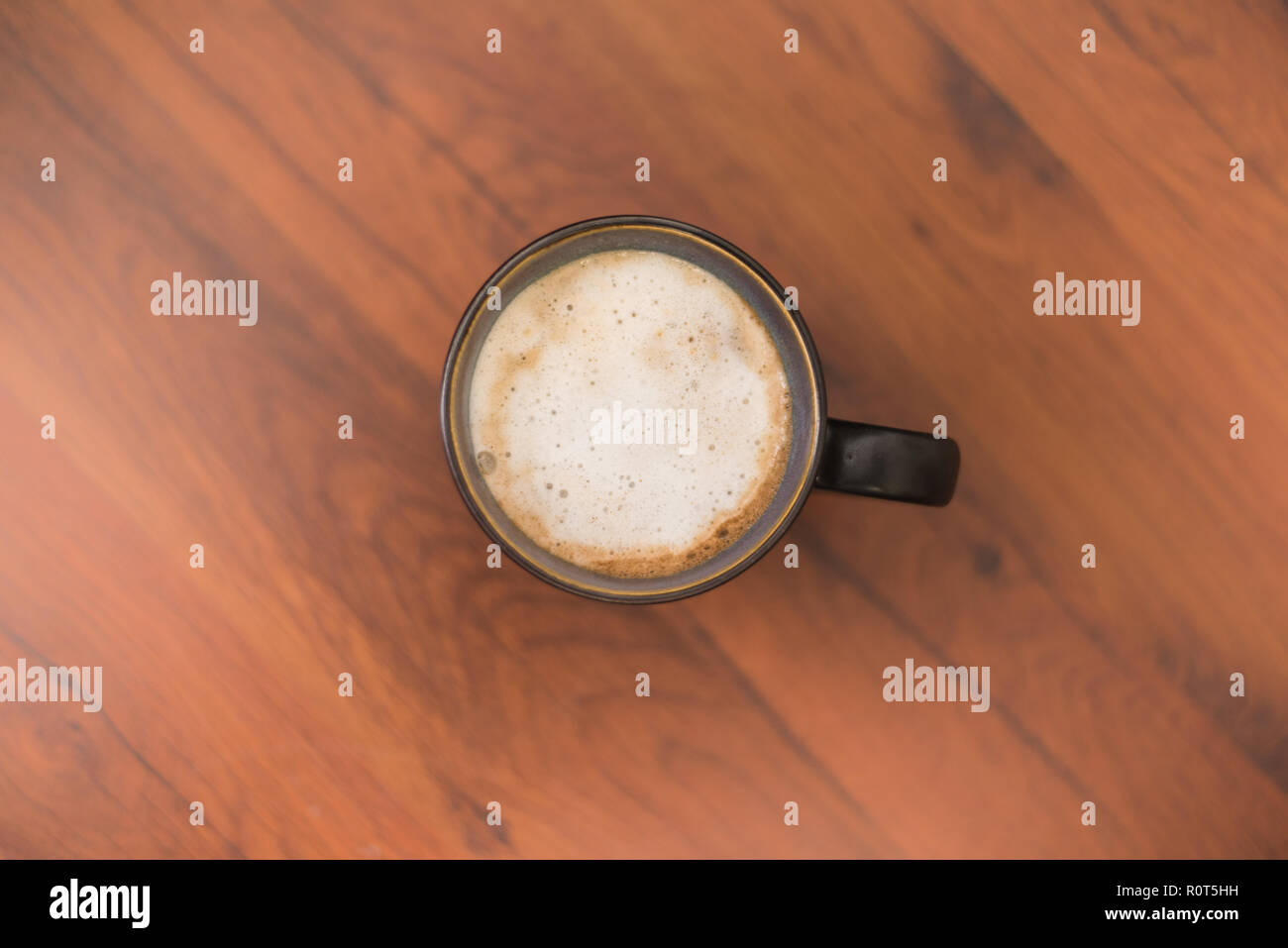 White coffee in a mug on dark wooden background Stock Photo - Alamy