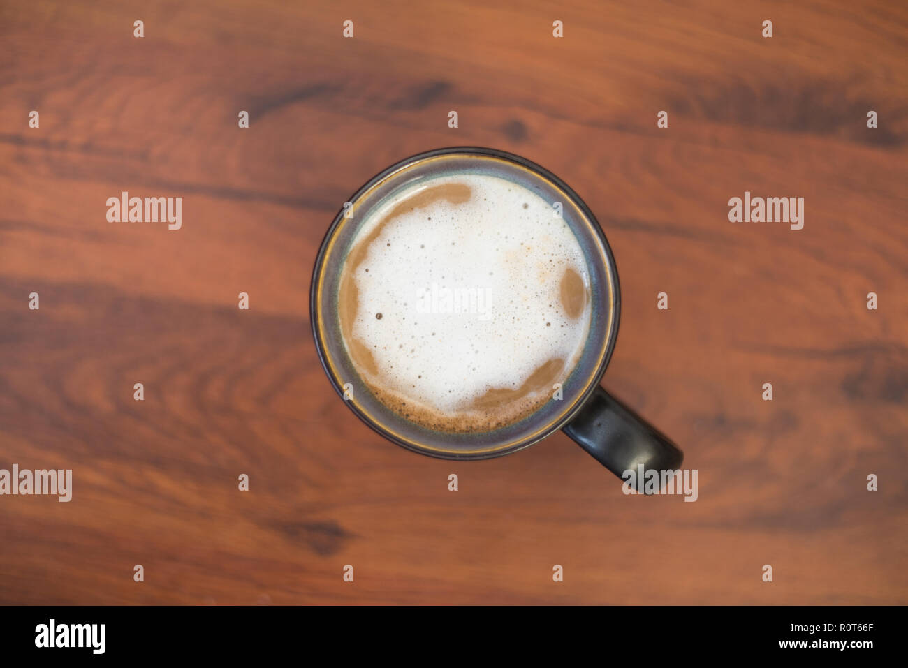 White coffee in a mug on dark wooden background Stock Photo - Alamy