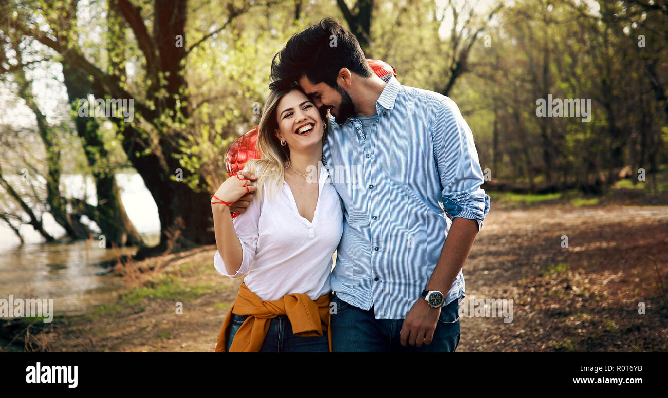 Man standing and holding white surprise gift box behind his back Stock ...