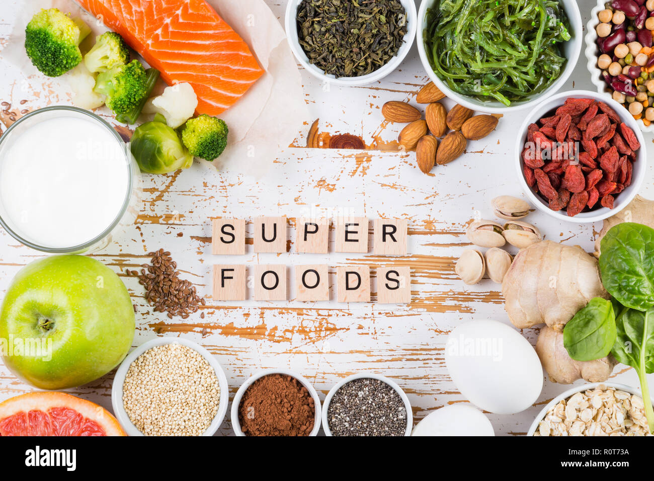 Selection of superfoods on rustic background Stock Photo - Alamy
