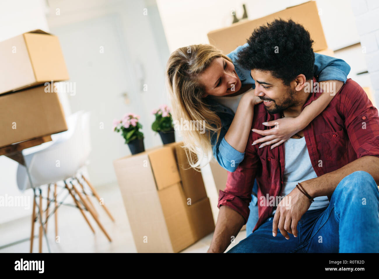 home, people, moving and real estate concept - happy couple having fun ...