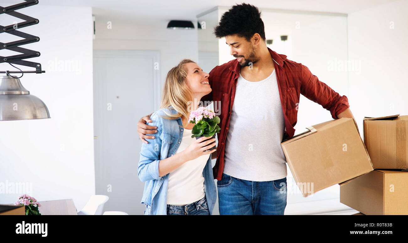 home, people, moving and real estate concept - happy couple having fun ...