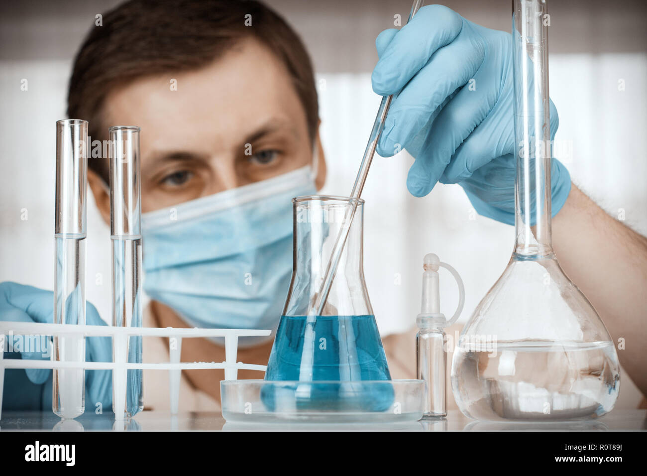 Laboratory scientist working at lab with test tubes Stock Photo - Alamy