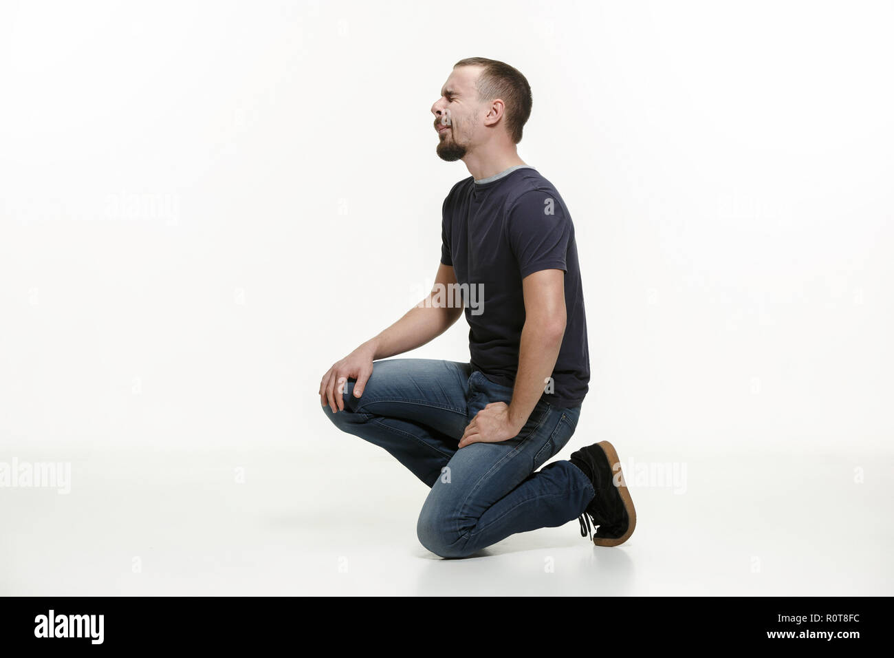 very disappointed man isolated on white studio background Stock Photo ...