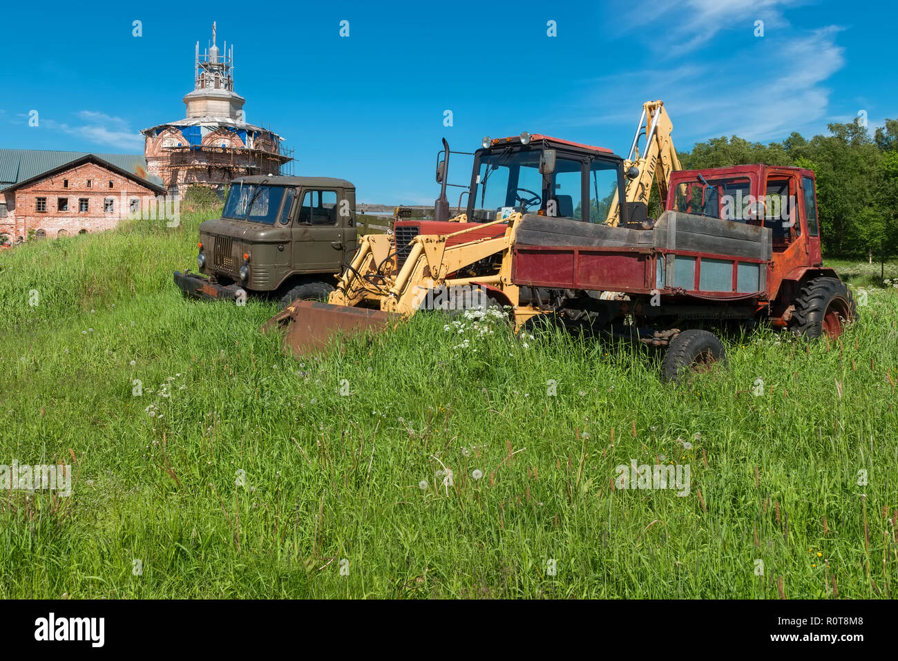 Cars and a tractor at the Trinity Skete on Anzersky Island, Solovetsky ...
