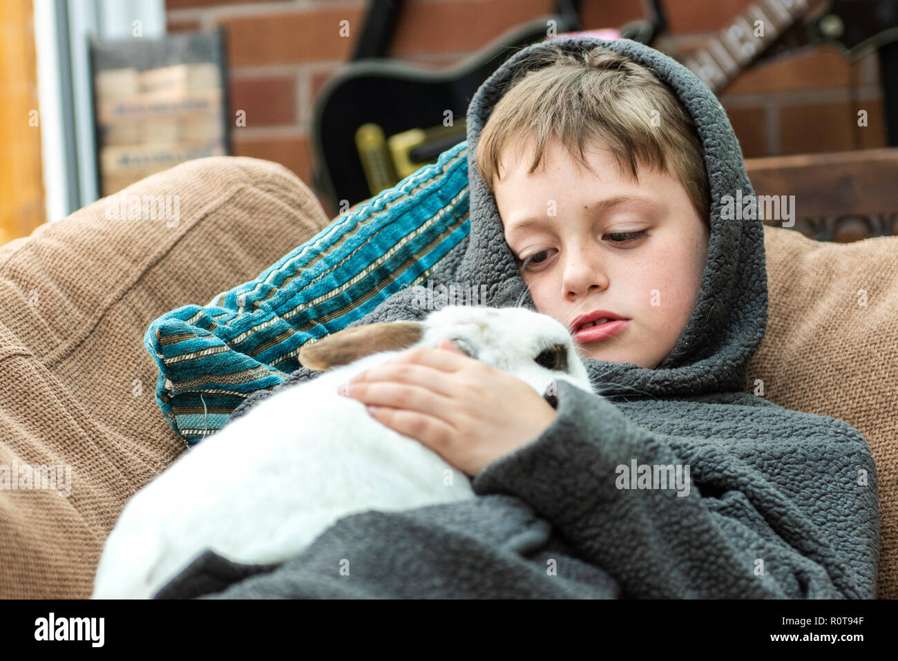 A handsome happy smiling little boy with autism, Aspergers syndrome and ...