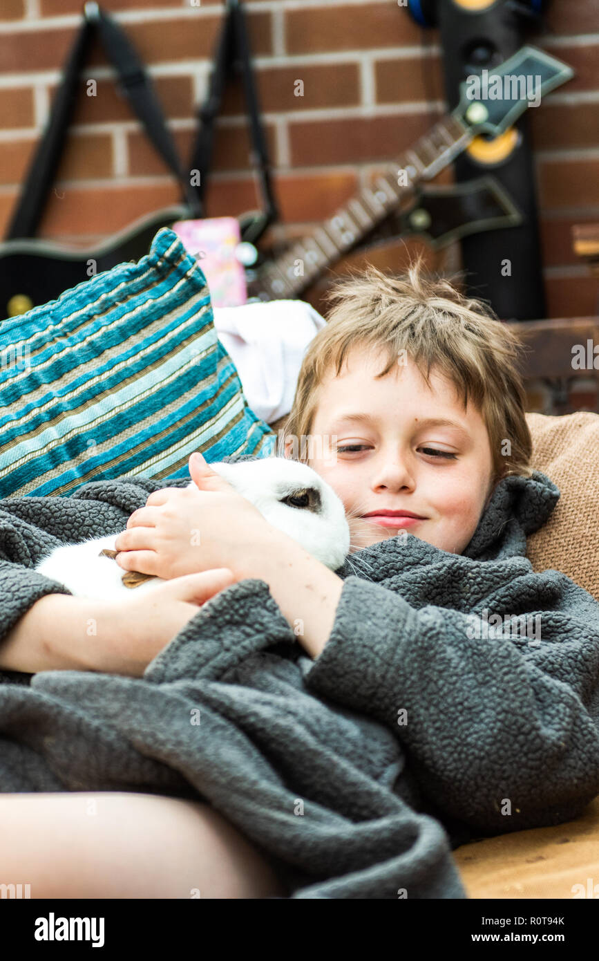 A handsome happy smiling little boy with autism, Aspergers syndrome and ...