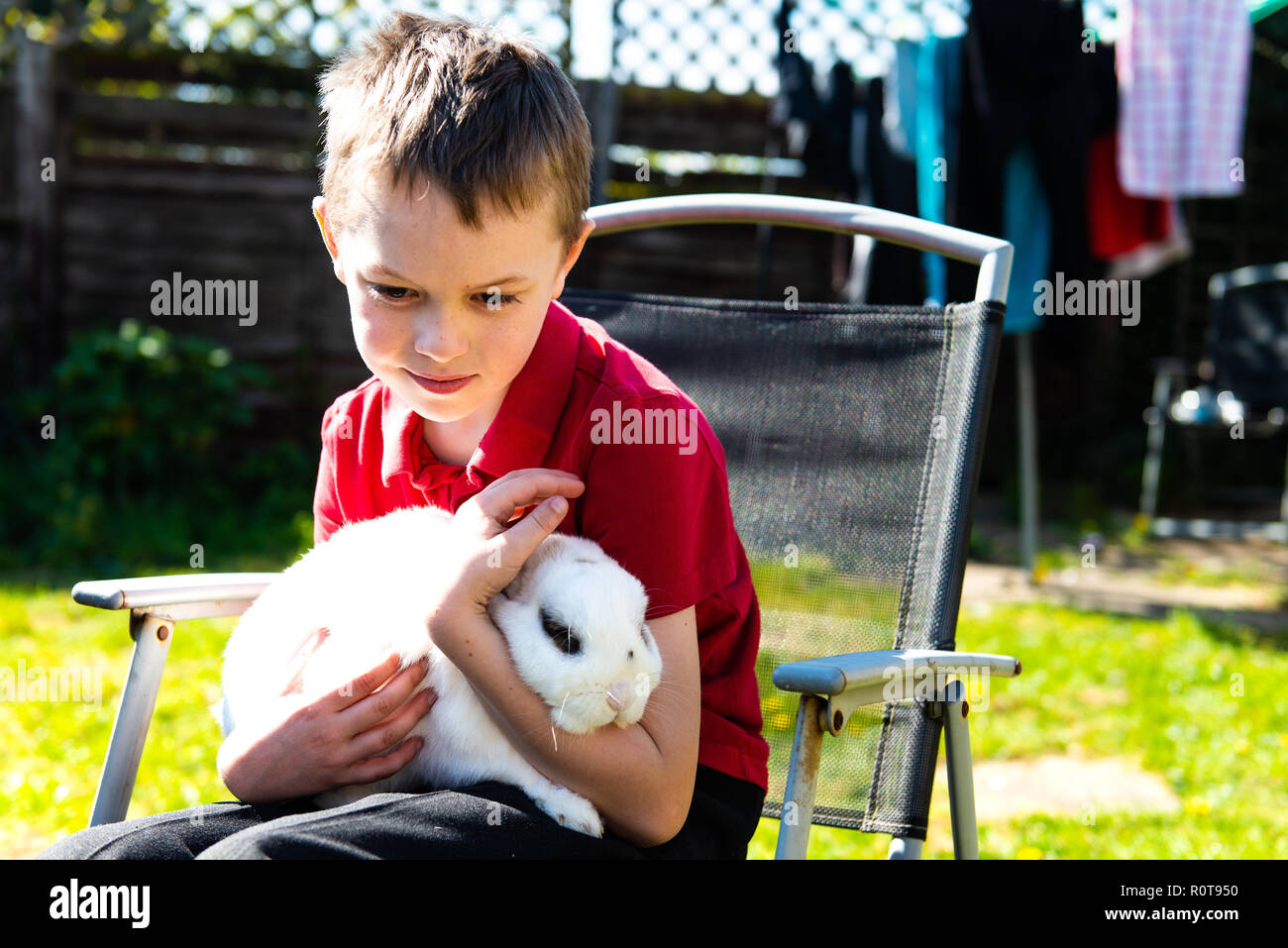 A handsome happy smiling little boy with autism, Aspergers syndrome and ...