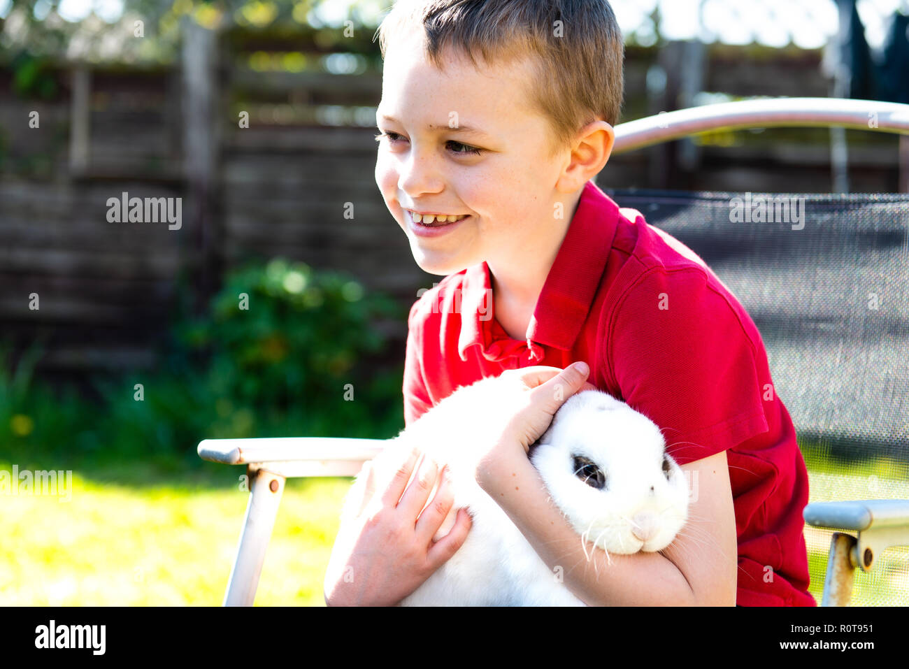 A handsome happy smiling little boy with autism, Aspergers syndrome and ...