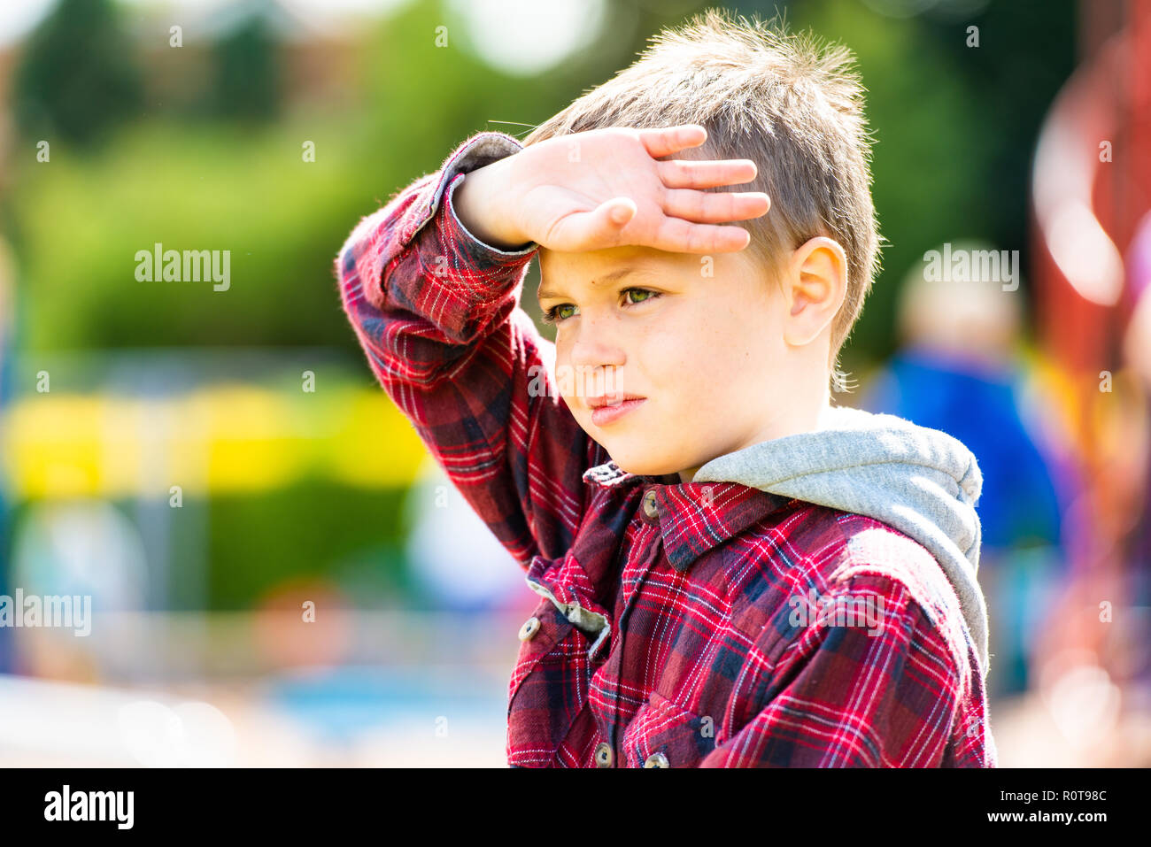 A handsome boy with ADHD, Autism, Asperger Syndrome sitting at the park ...
