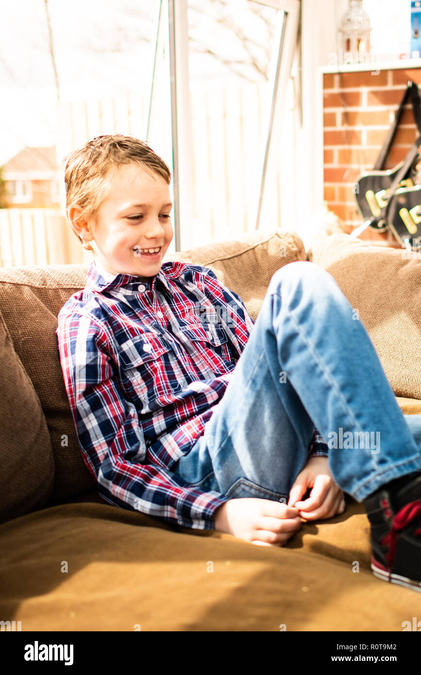 A handsome little boy with ADHD, Autism, Aspergers Syndrome laughing ...