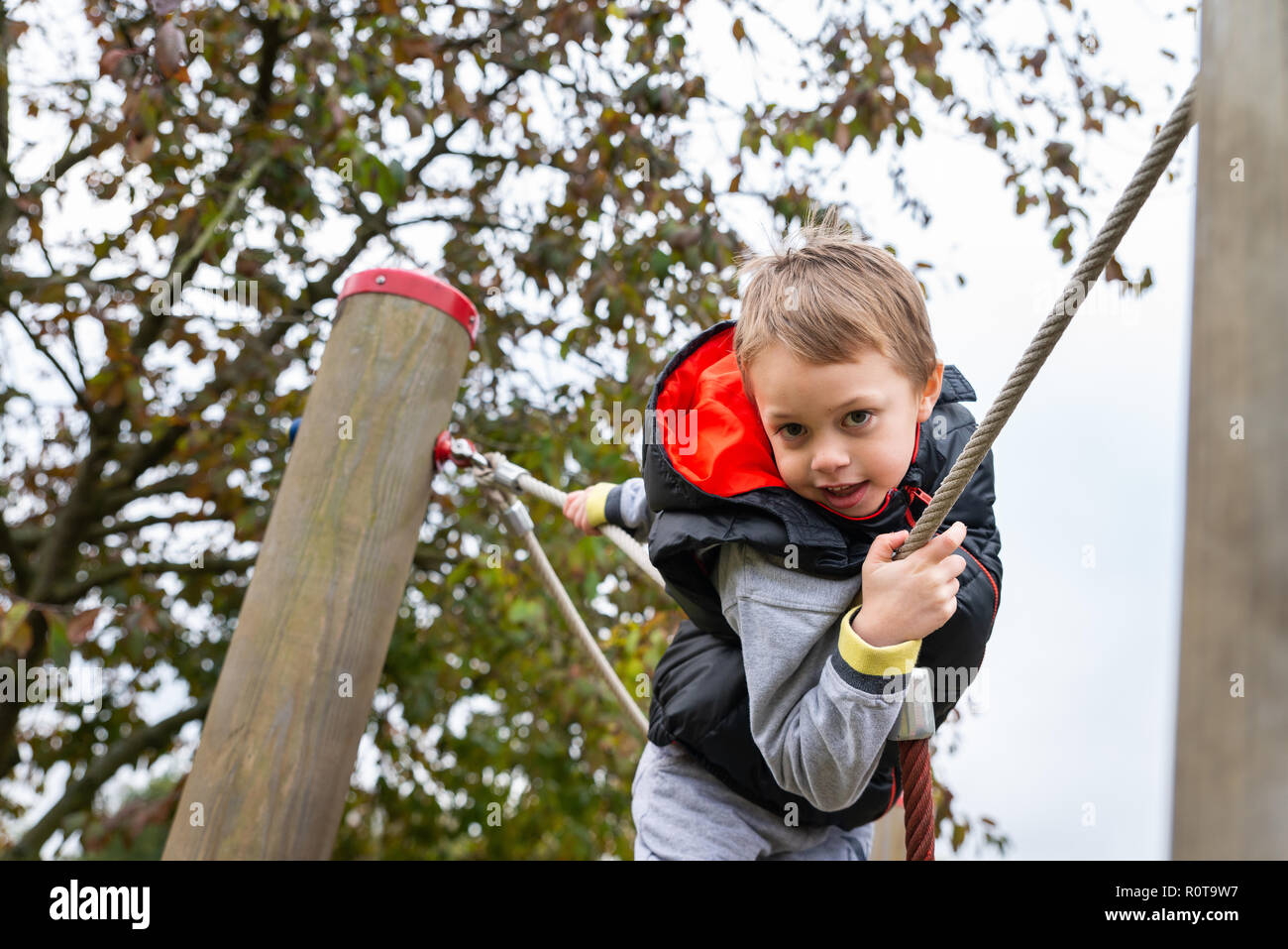 A handsome little boy with ADHD, Autism, Aspergers syndrome enjoys ...