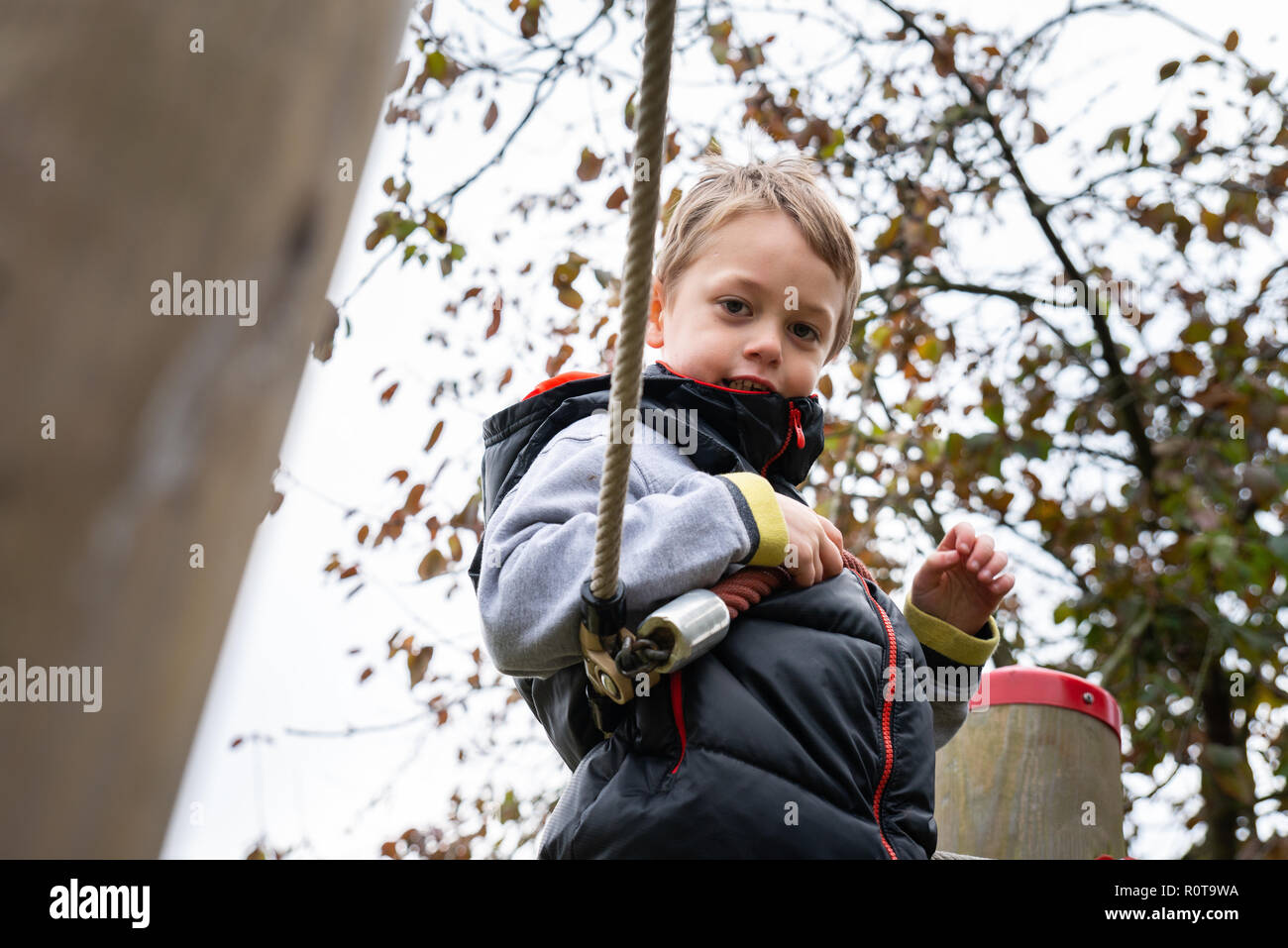 A handsome little boy with ADHD, Autism, Aspergers syndrome enjoys ...
