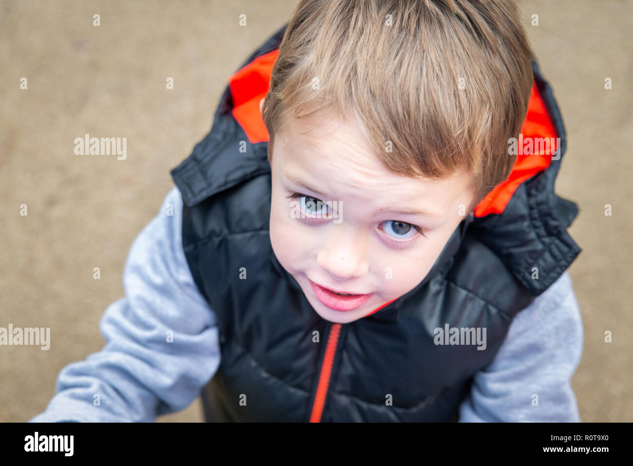 A handsome little boy with ADHD, Autism, Aspergers syndrome enjoys ...