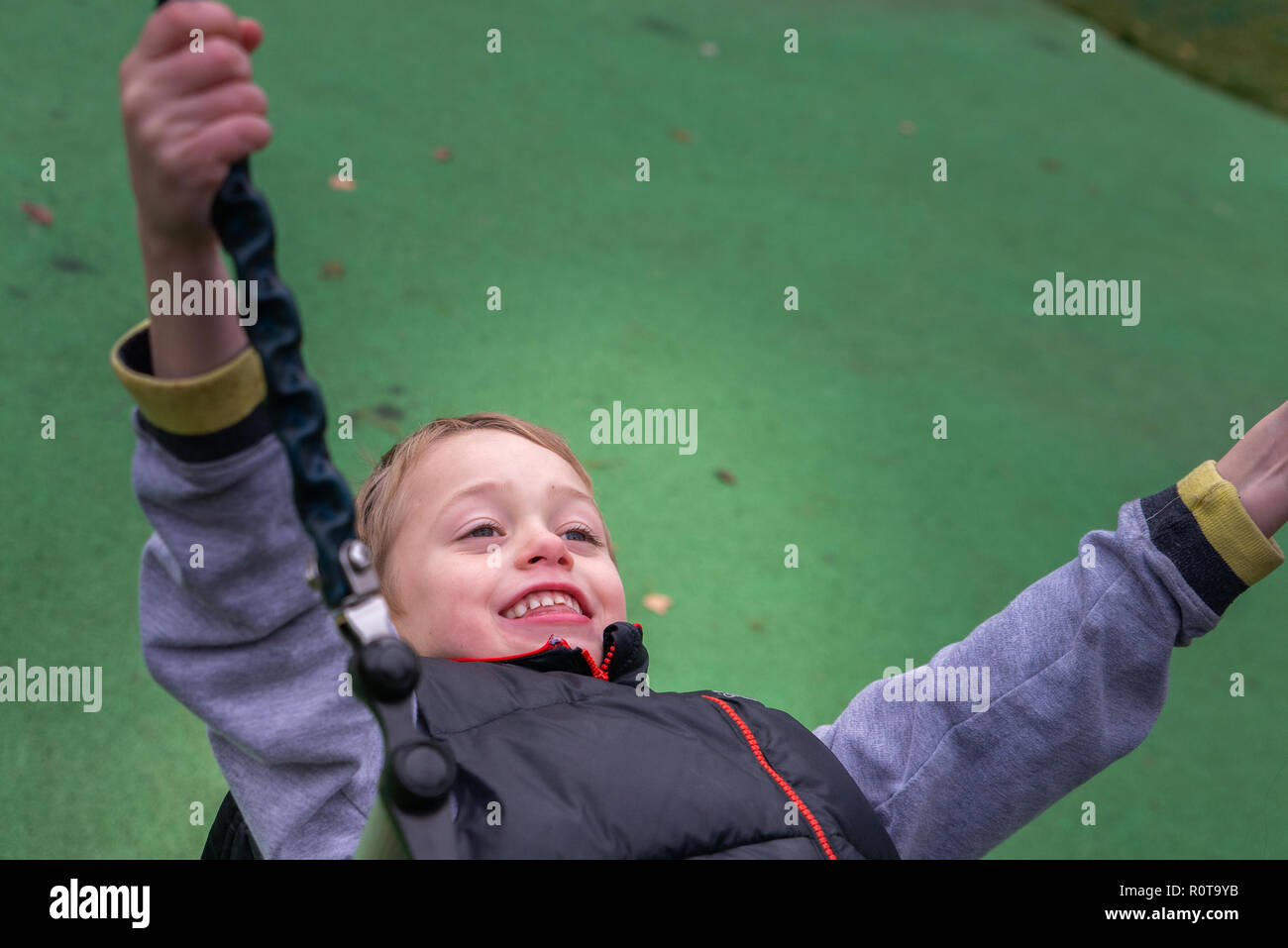 A handsome little boy with ADHD, Autism, Aspergers Syndrome plays ...