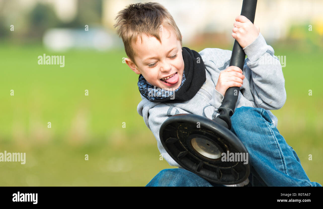 A handsome little boy with ADHD, Autism, Aspergers Syndrome plays ...