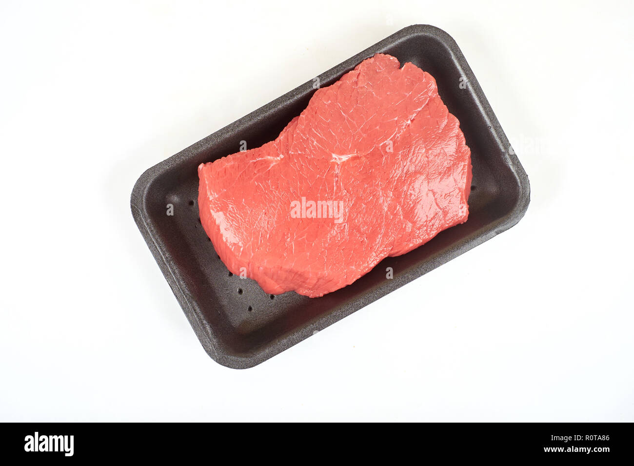 Big red meat in package, on white background Stock Photo - Alamy