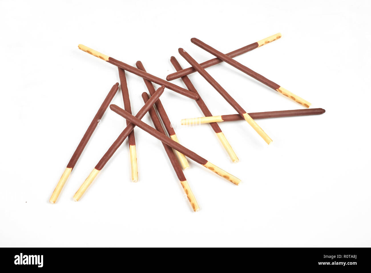 Biscuit sticks in chocolate coating on white background Stock Photo - Alamy